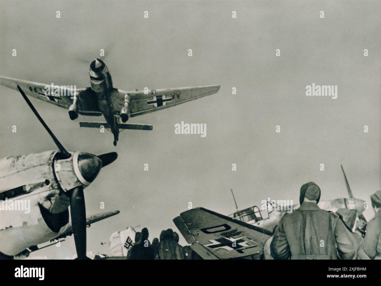 A photograph shows a Junkers Ju 87 (Stuka) taking off over the parking area of the squadron ...