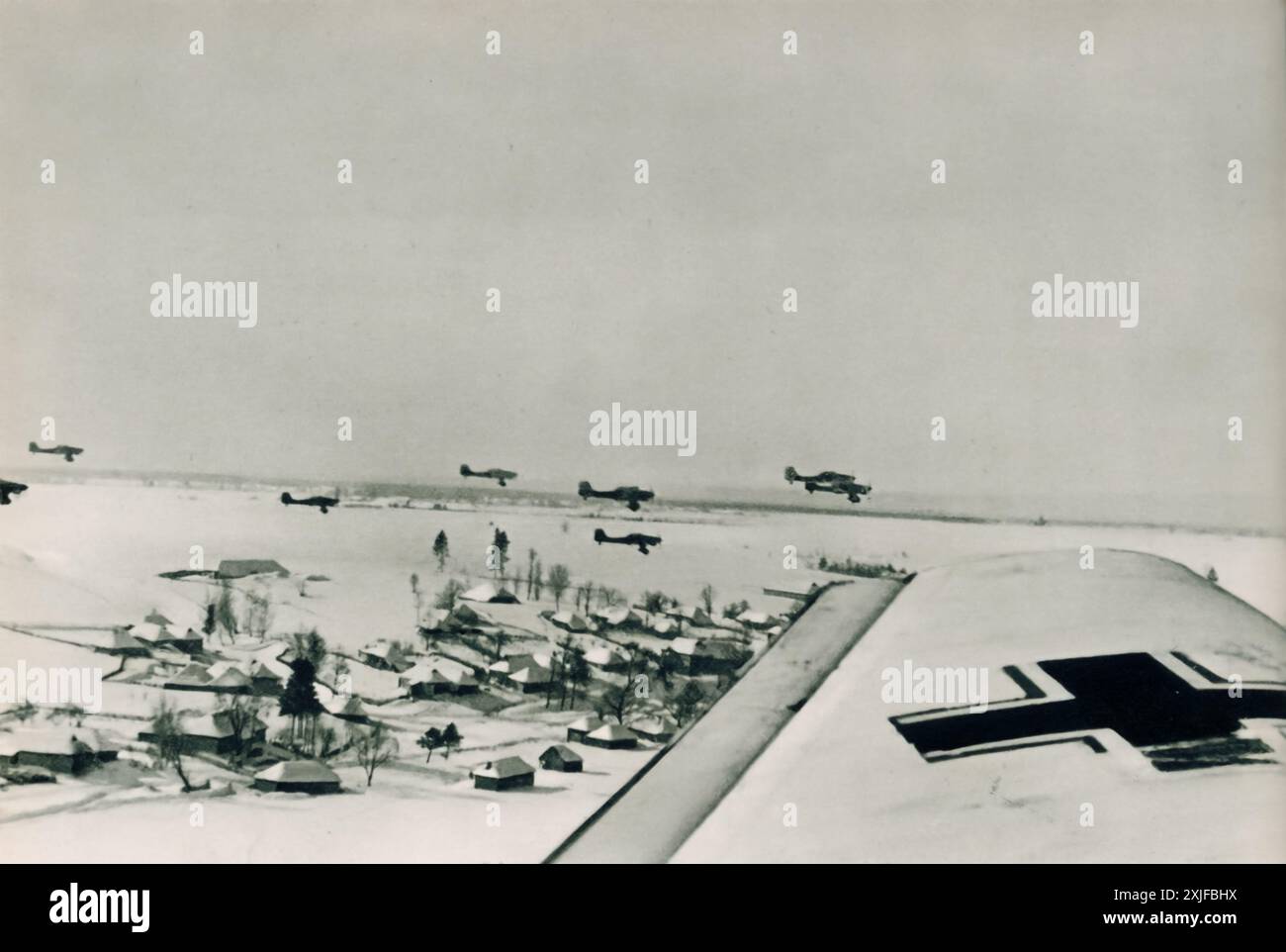 A photograph shows a formation of Junkers Ju 87 (Stuka) aircraft ...