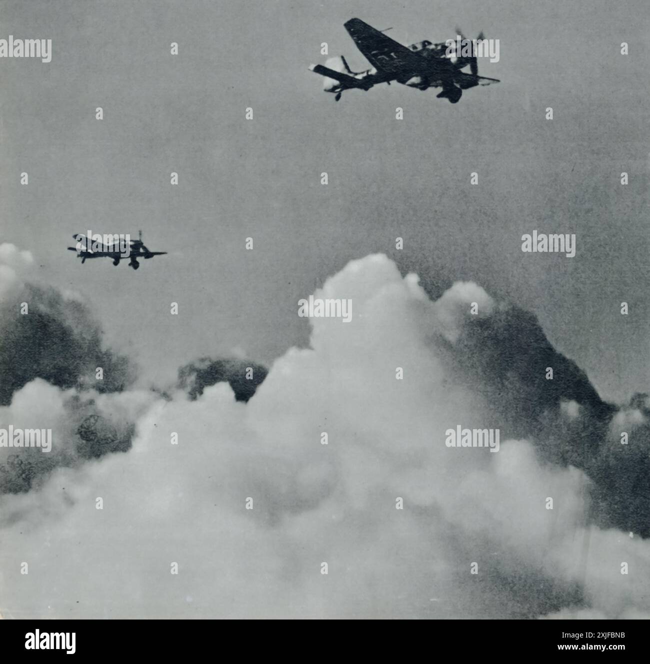 A photograph shows a Luftwaffe aircraft using dense cloud cover to ...