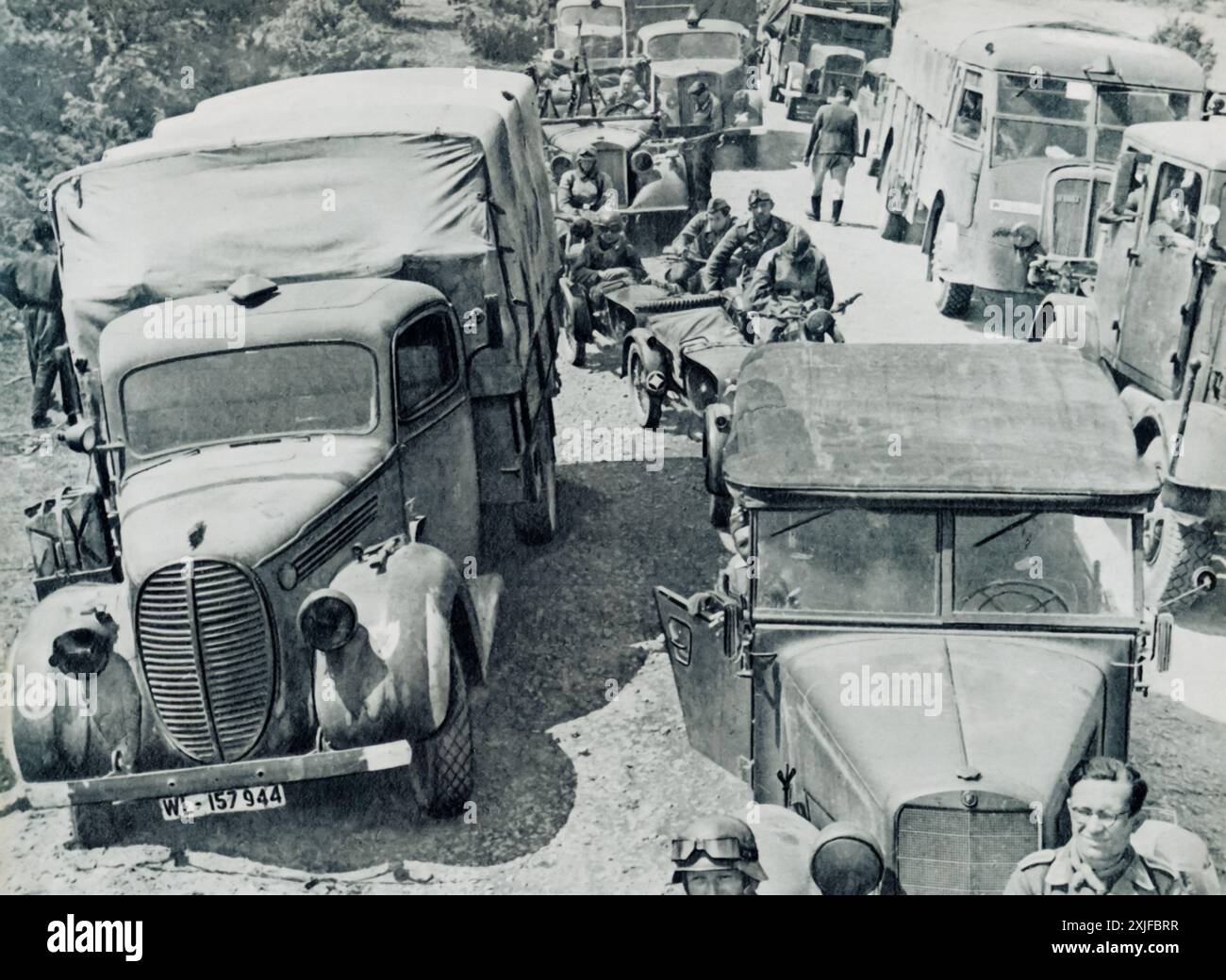 A photograph shows a convoy of German military units and supplies being ...