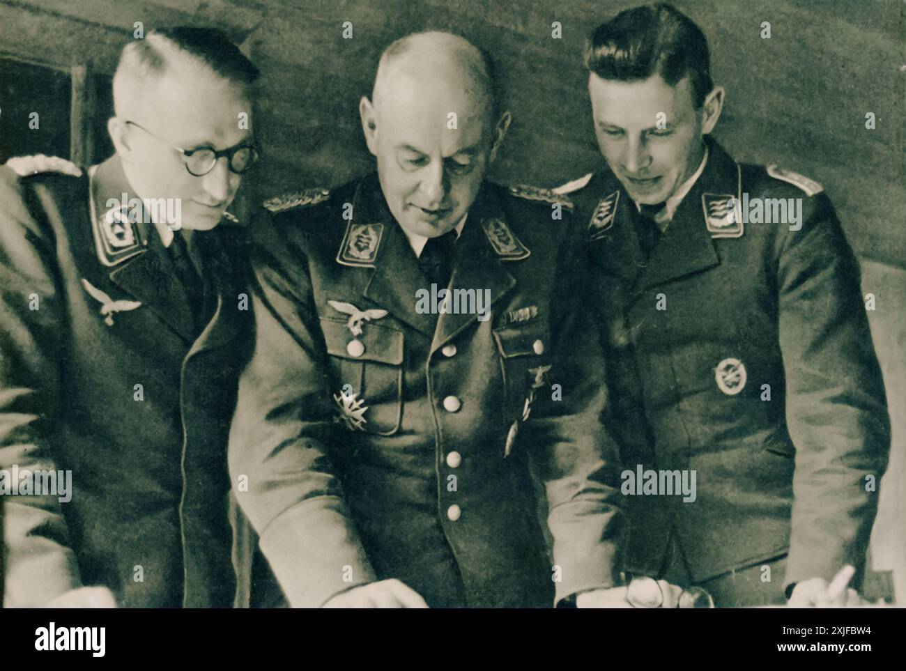 A photograph shows, from left to right, Amtmann (administrative ...