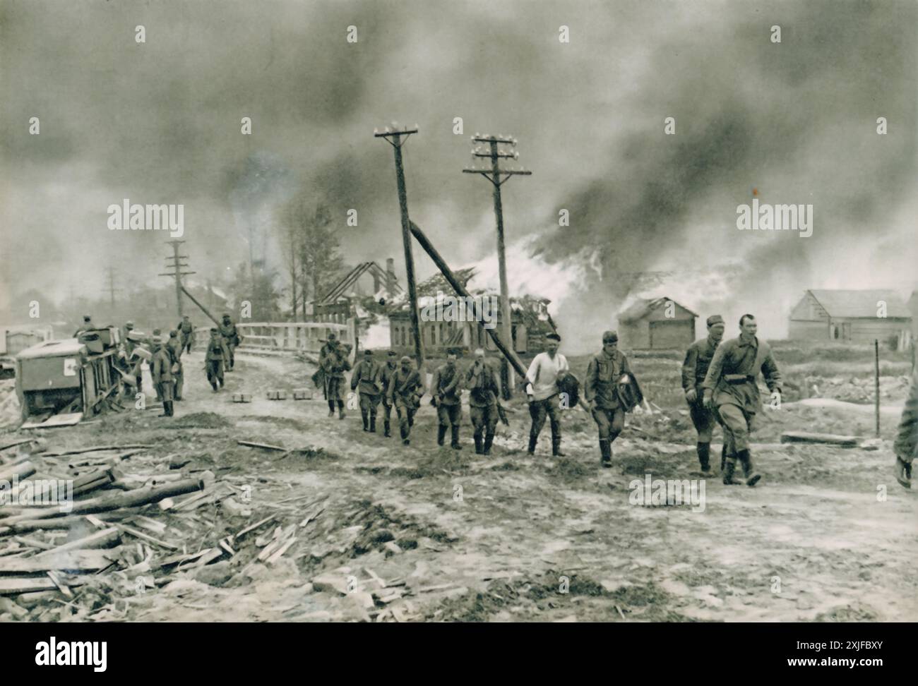 A photograph shows Bolshevik soldiers surrendering as prisoners of war ...
