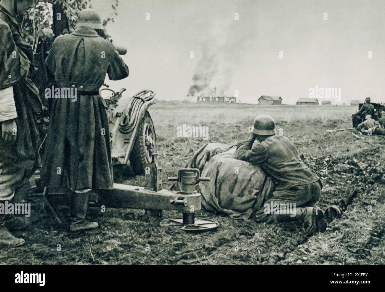 A photograph shows German soldiers using artillery weapons against ...