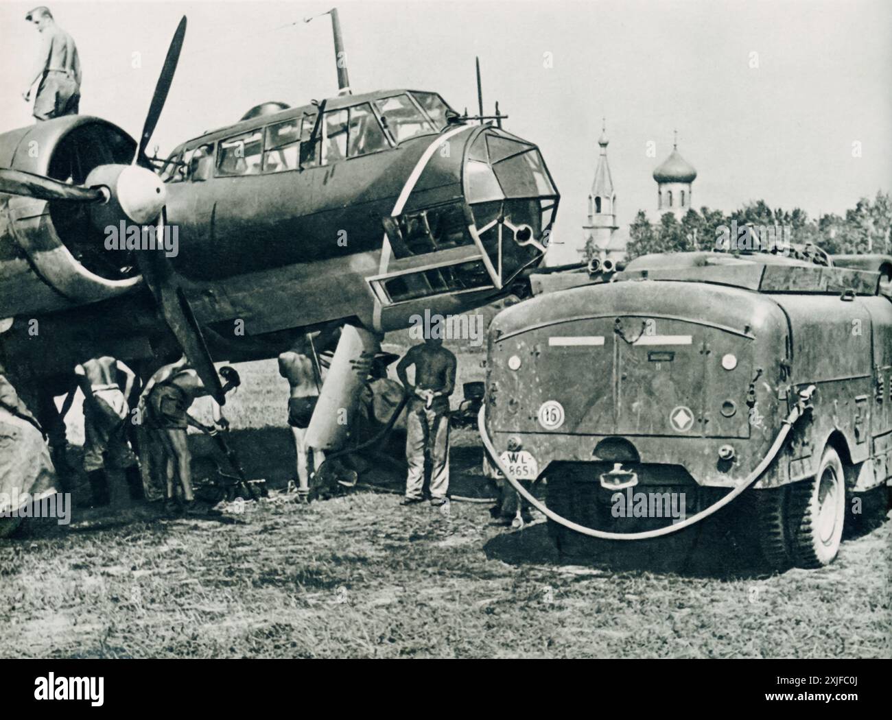 A photograph shows soldiers refueling a Dornier Do 17 during Operation ...