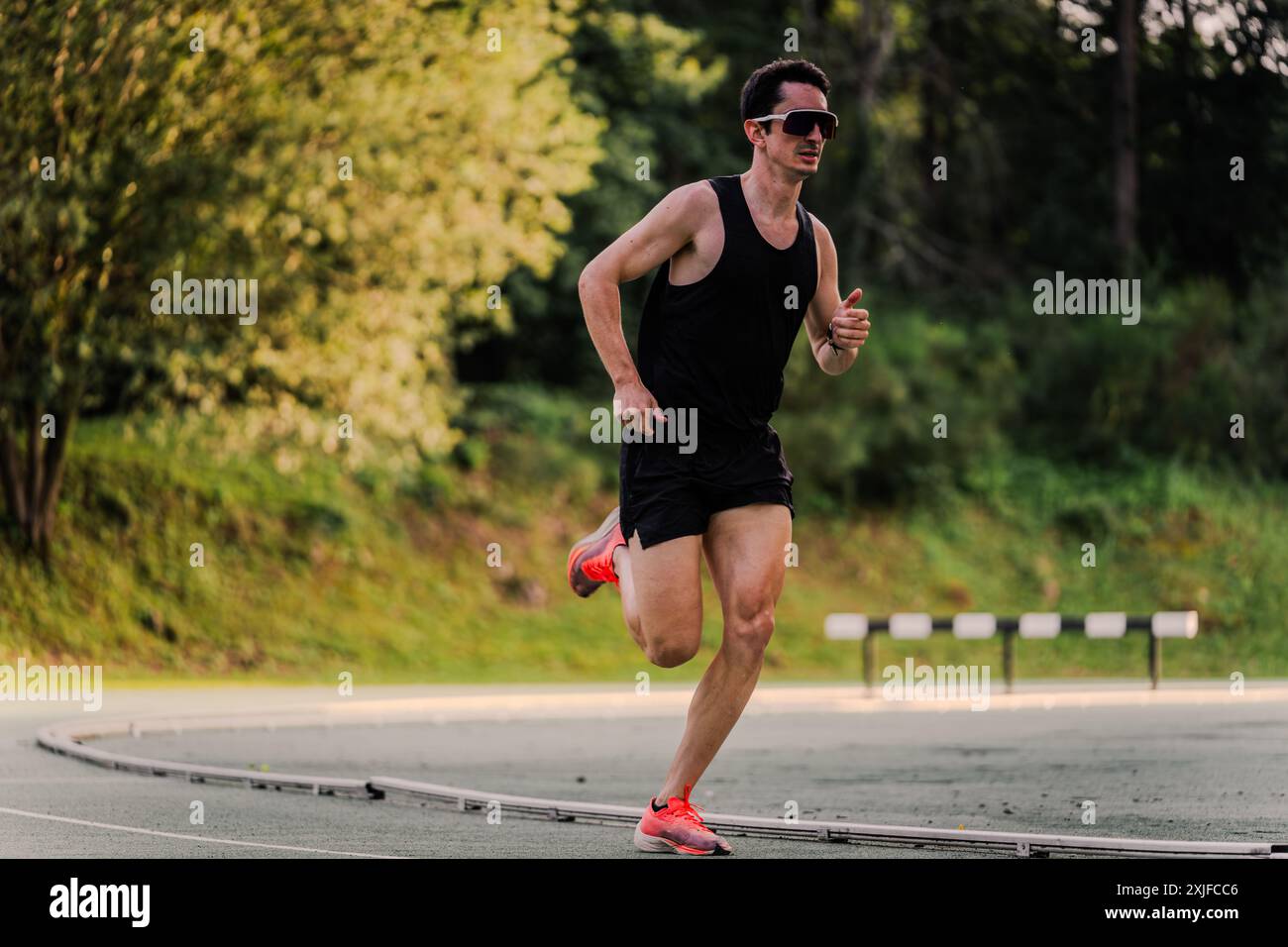 Professional athlete wearing sunglasses running the last meters of the ...