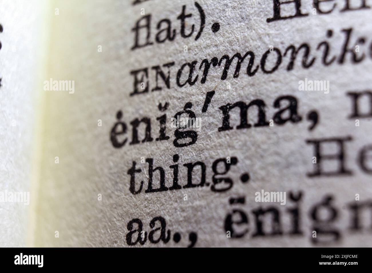 Word enigma on dictionary page, macro close-up Stock Photo - Alamy