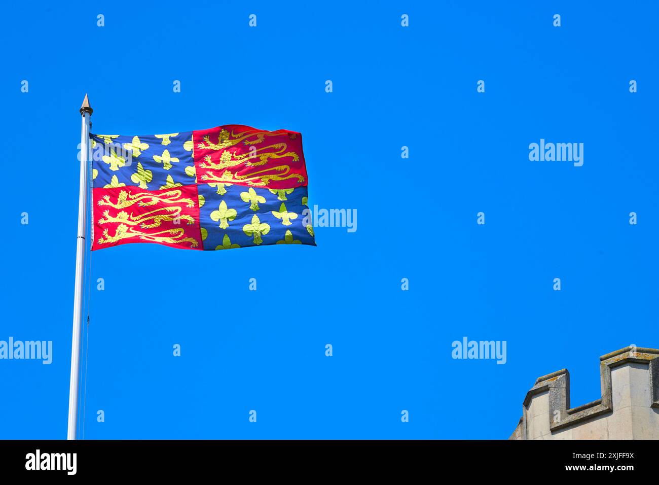 A flag flutters over Trinity College, University of Cambridge, England ...