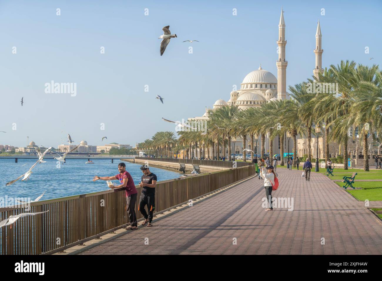 The tourists and local people on Sharjah Corniche (waterfront) at ...