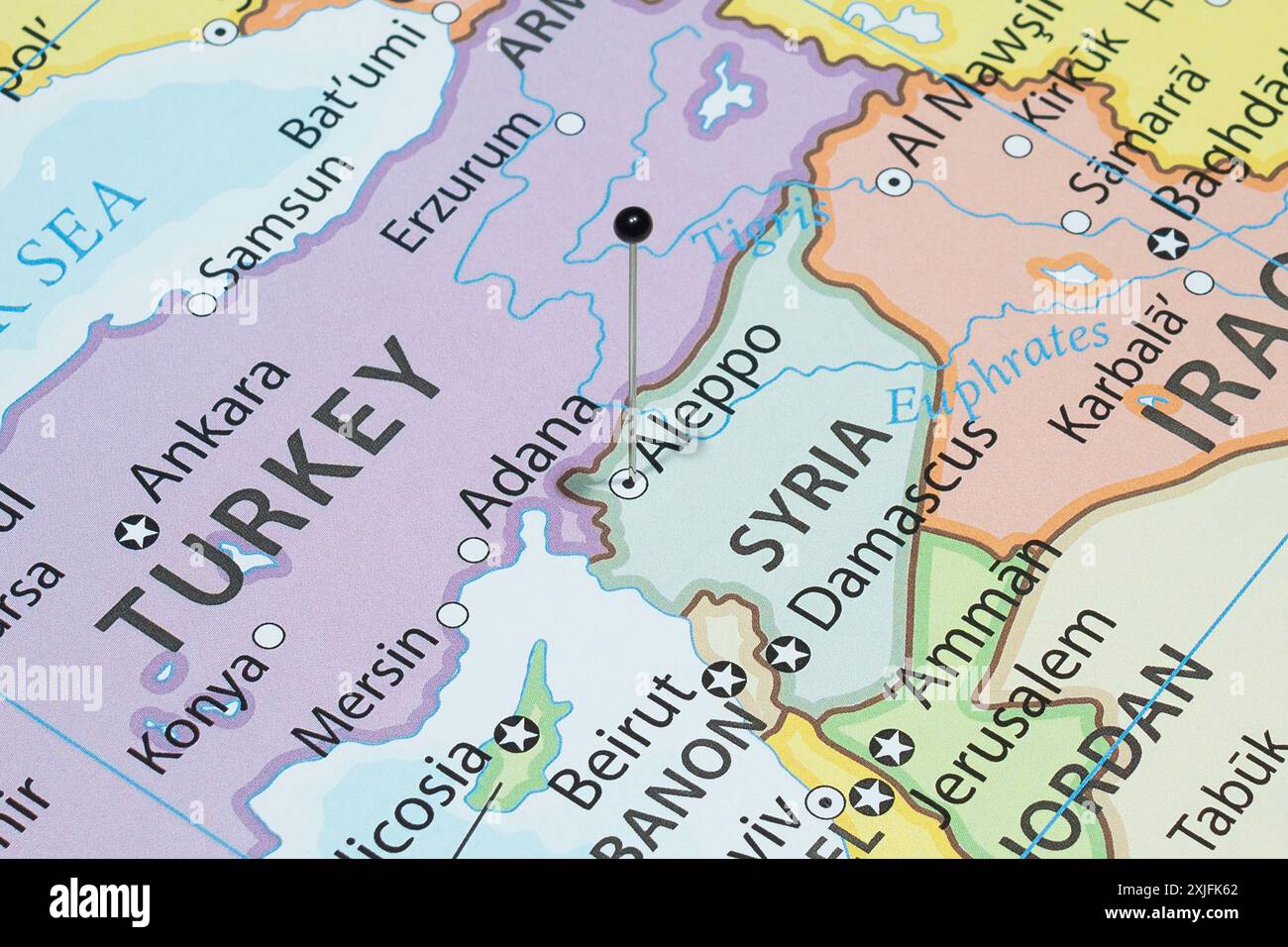 Close up to a Aleppo city with a black pin needle into Syria country ...