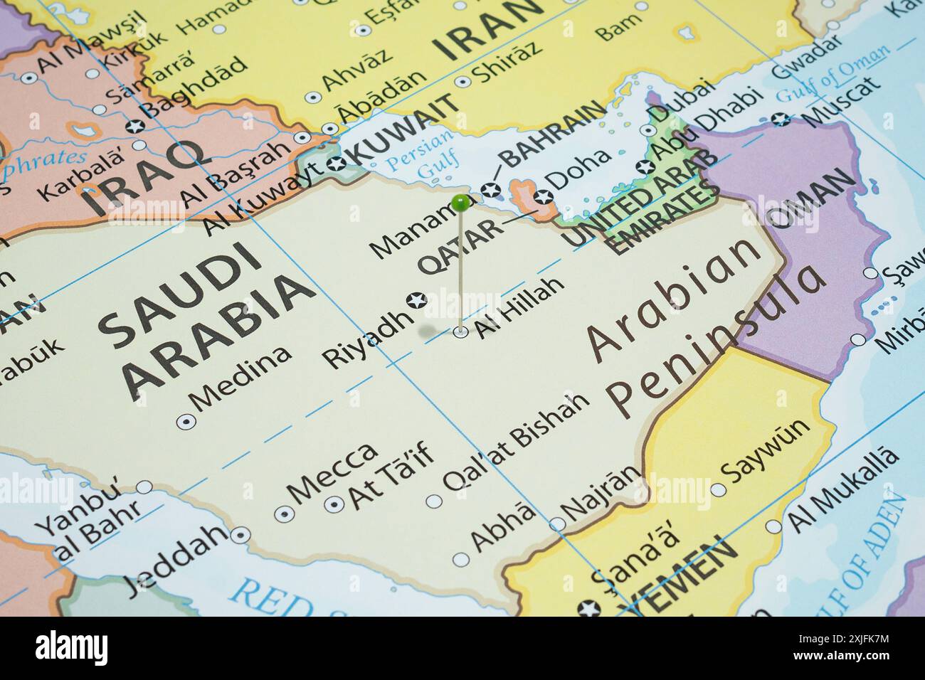 Close up to a Al Hillah city with a green pin needle into Saudi Arabia ...