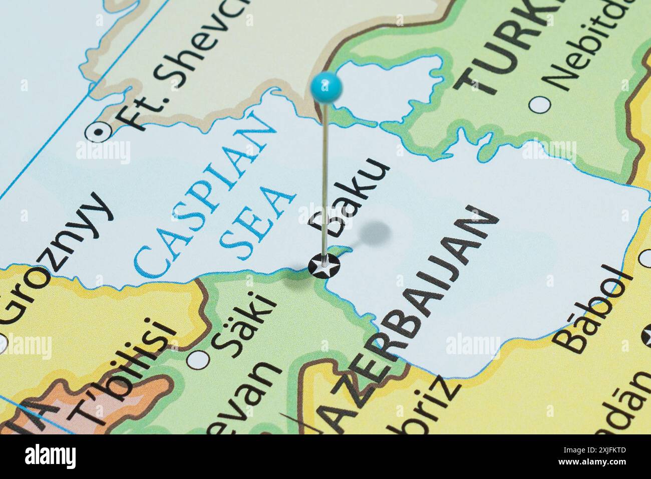 Close up to a Baku city with a light blue pin needle into Azerbaijan ...