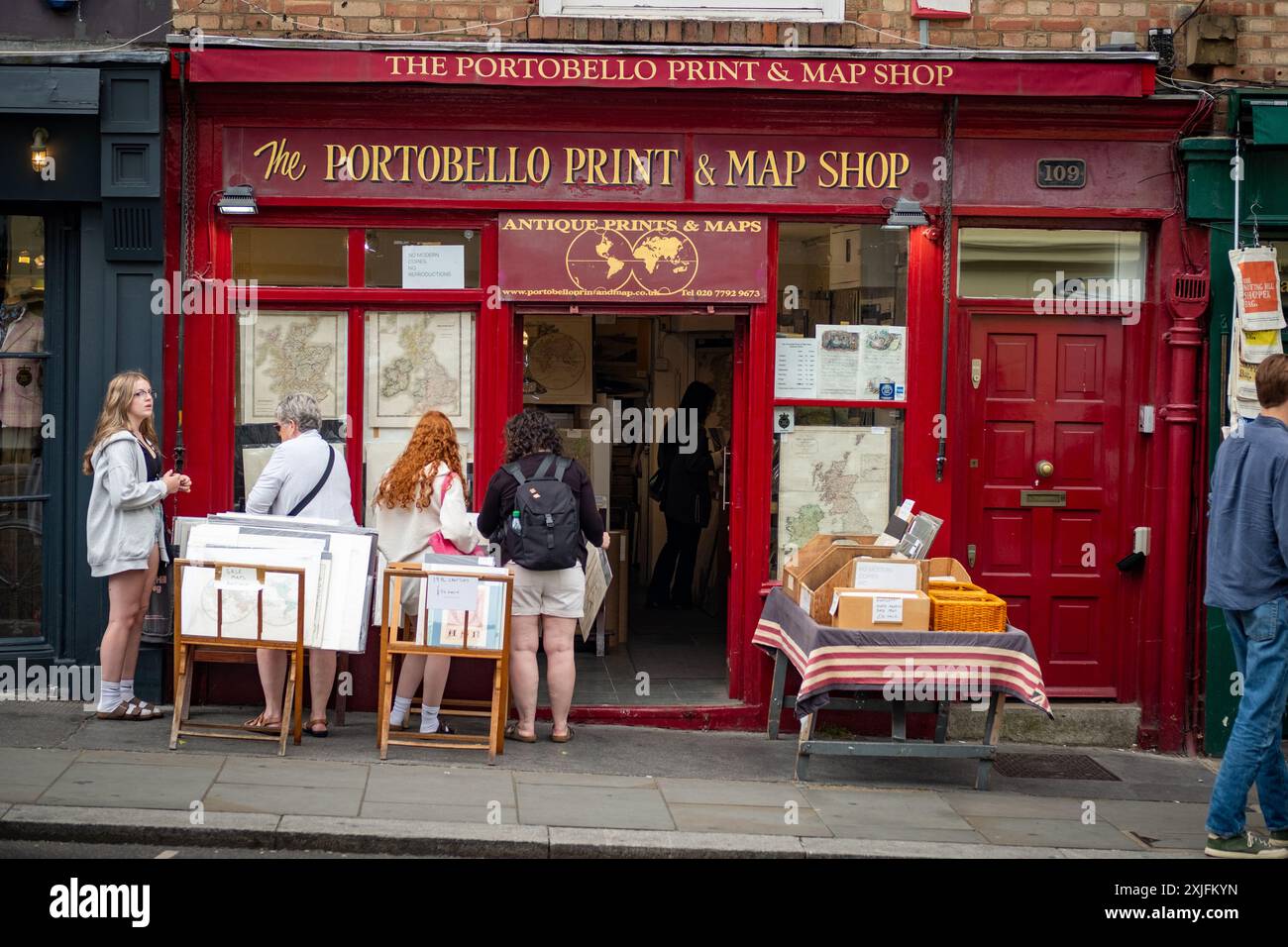 LONDON- JULY 1, 2024: Map print shop scene on Portobello Road, a ...