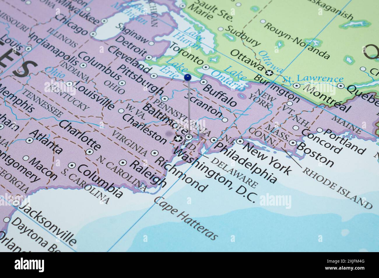 Close up to a Baltimore city with a blue pin needle into United States ...