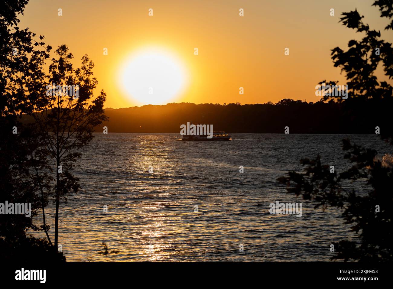 Harbour ferry in sunset Stock Photo - Alamy