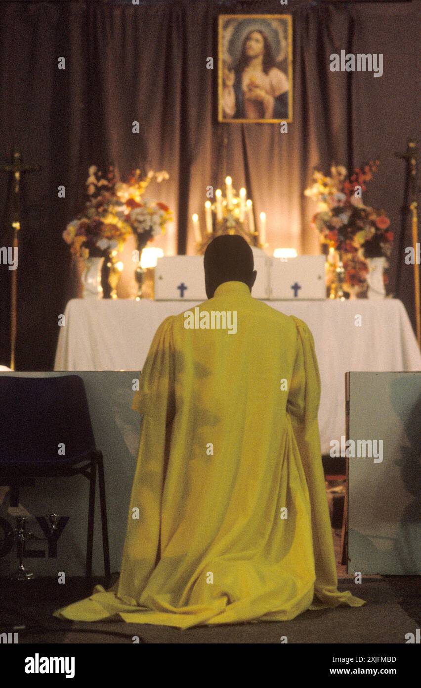 Black British African church. Priest praying at alter Celestial Church ...