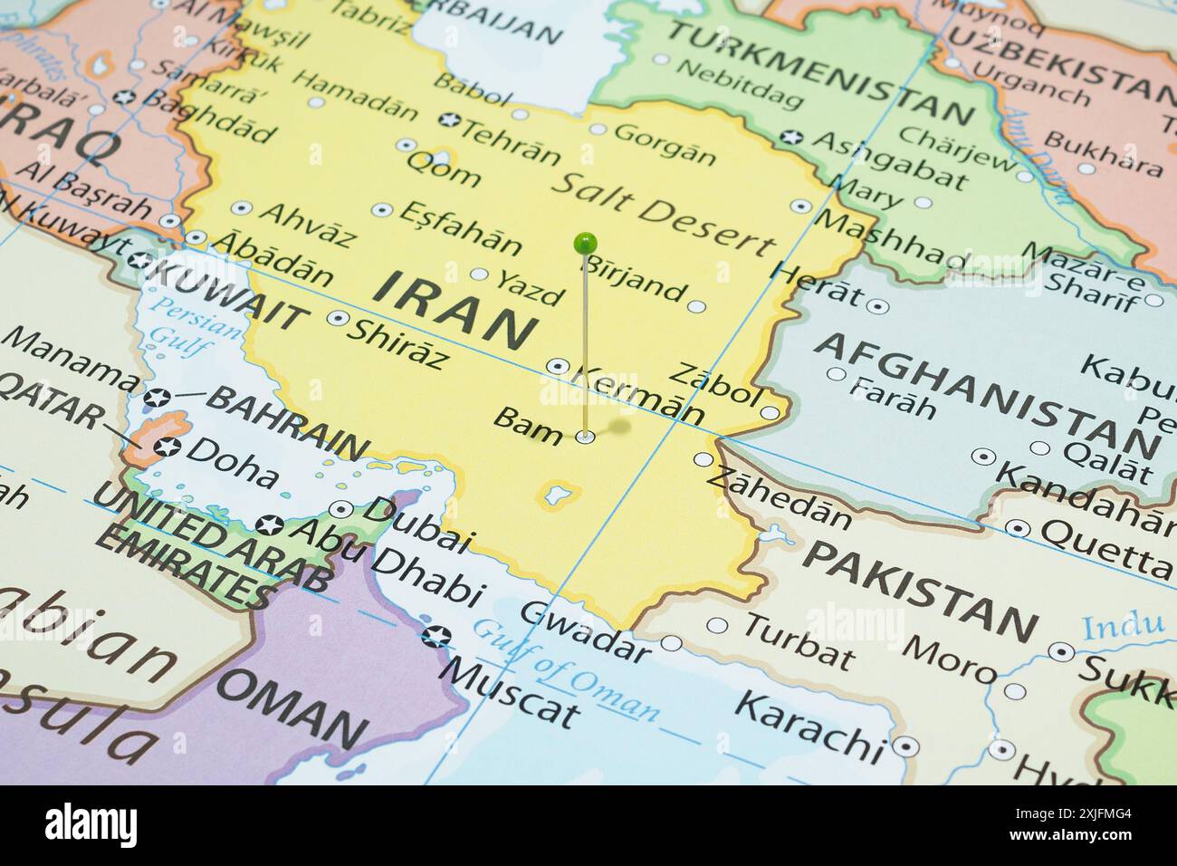 Close up to a Ban city with a green pin needle into Iran country ...