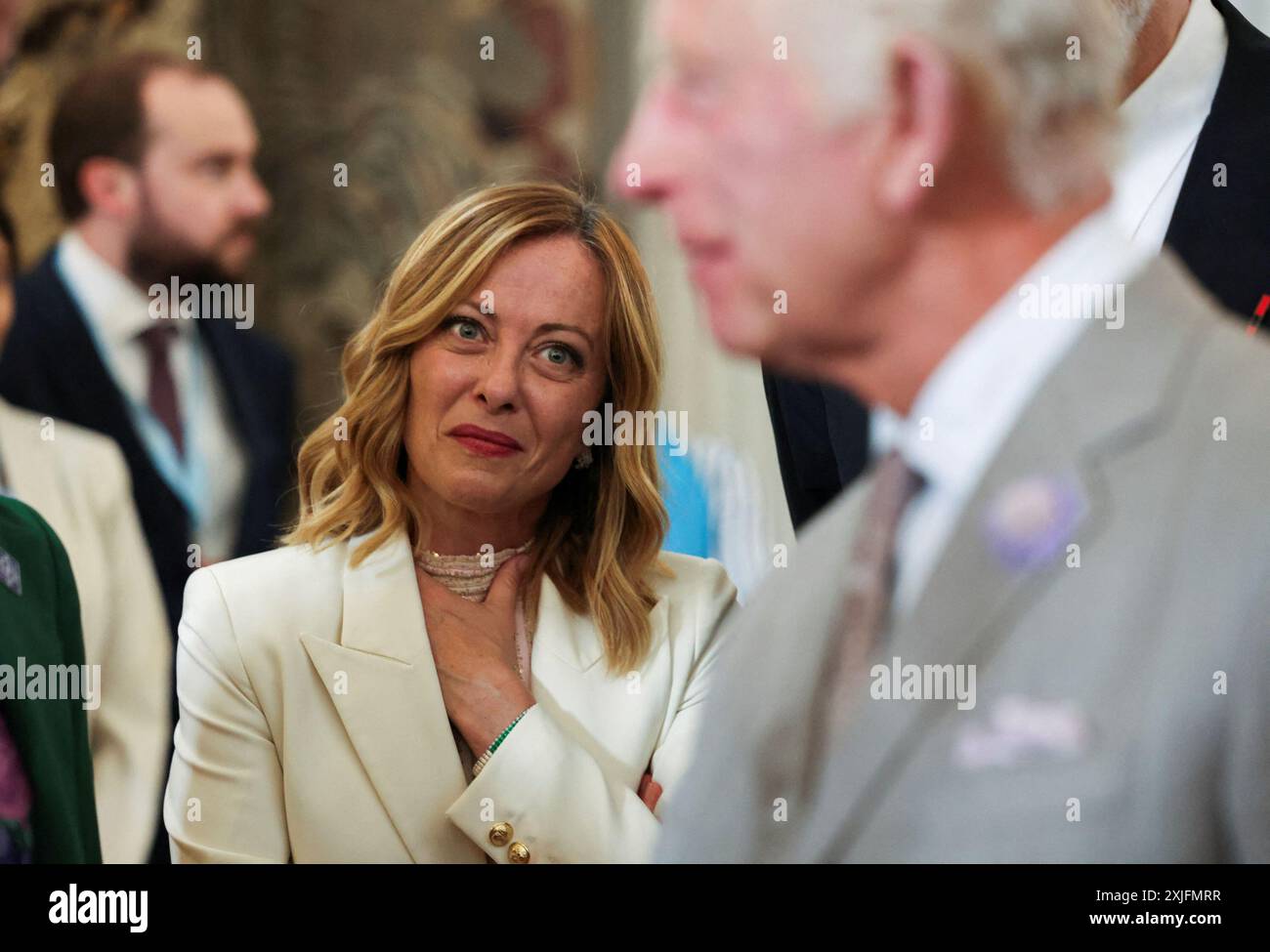 Italy's Prime Minister Giorgia Meloni looks at King Charles III, during ...