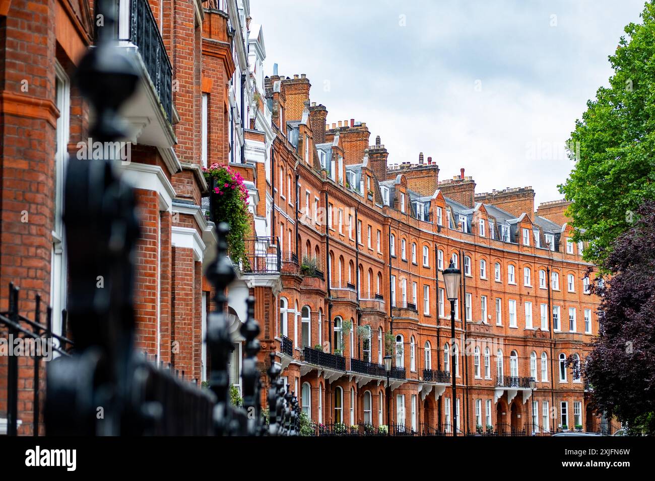 LONDON- JULY 10, 2024: Upmarket London red brick mansion buildings in ...