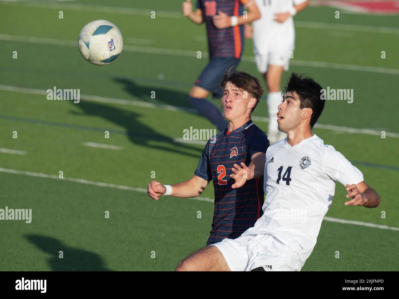 Seven Lakes' Joshua Taylor (2) and Miguel Arenas (14) of Flower Mound ...