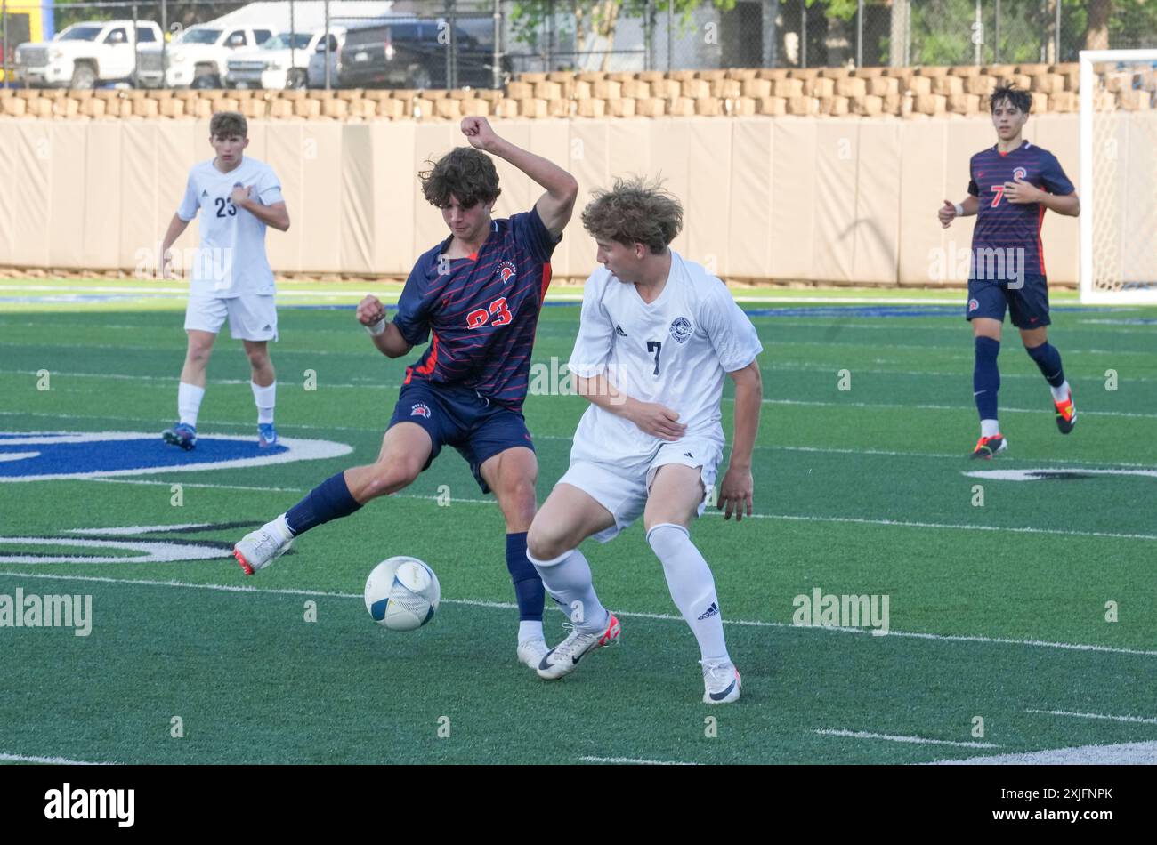 Seven Lakes' Sam Harpole (23) battles Landon Deleeuw (7) for the ball ...