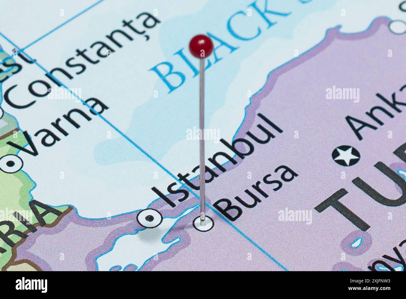Close up to a Bursa city with a red pin needle into Turkey country ...
