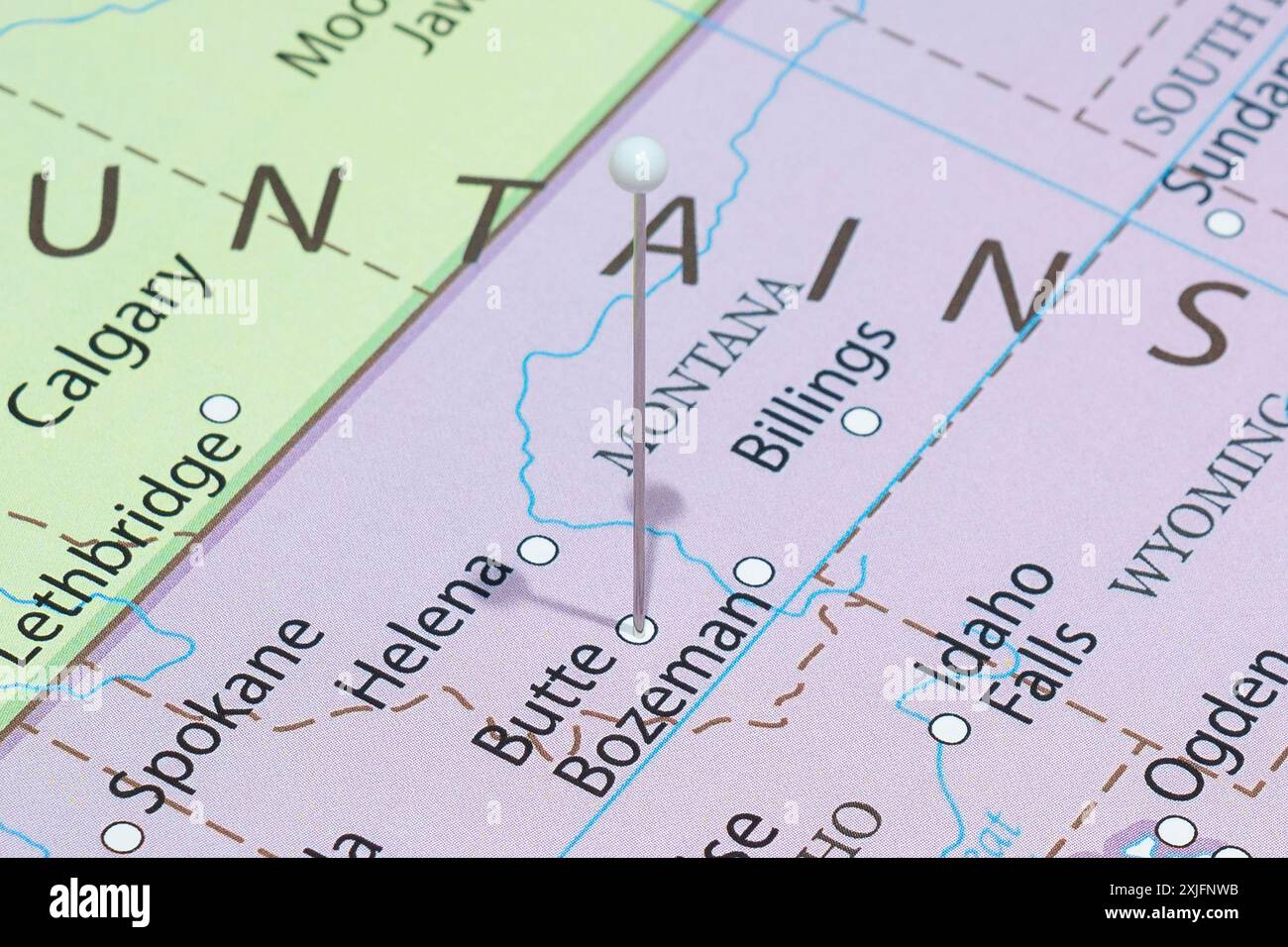 Close up to a Butte city with a white pin needle into United States of ...