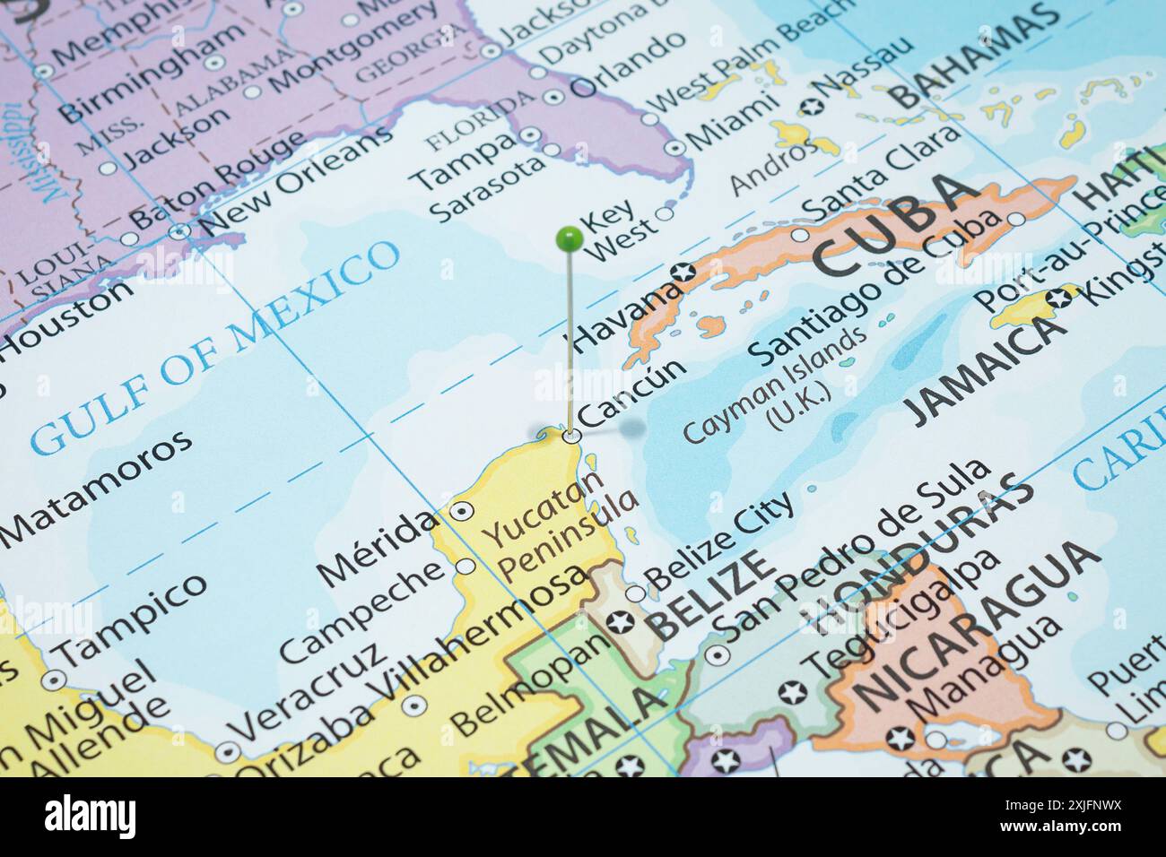 Close up to a Cancun city with a green pin needle into Mexico country ...