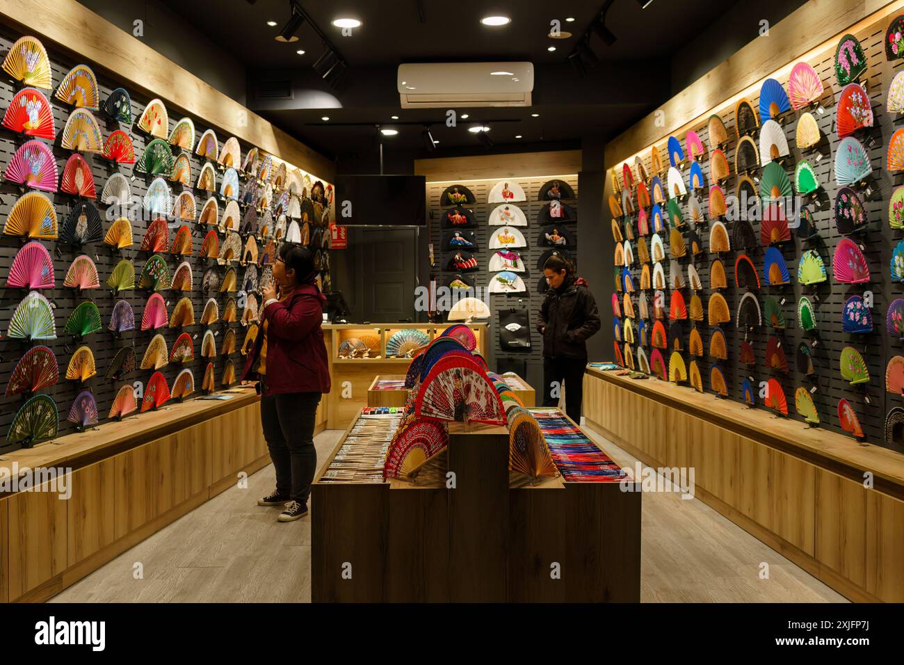 Seville, Spain. February 4, 2024 - Colorful spanish fans displayed in a ...