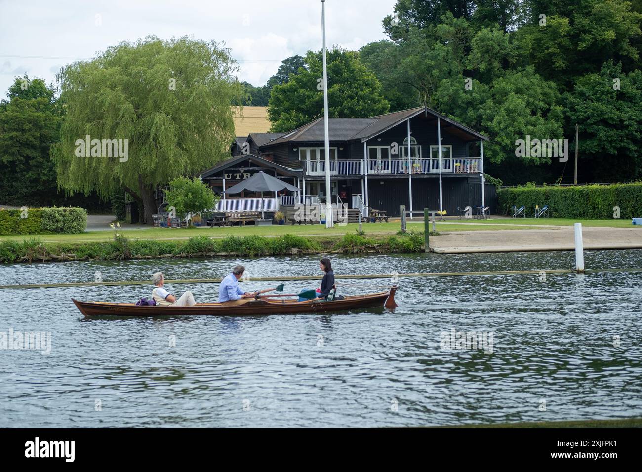 HENLEY ON THAMES, OXFORDSHIRE, UK- JULY 14, 2024: Rowing past Henley ...