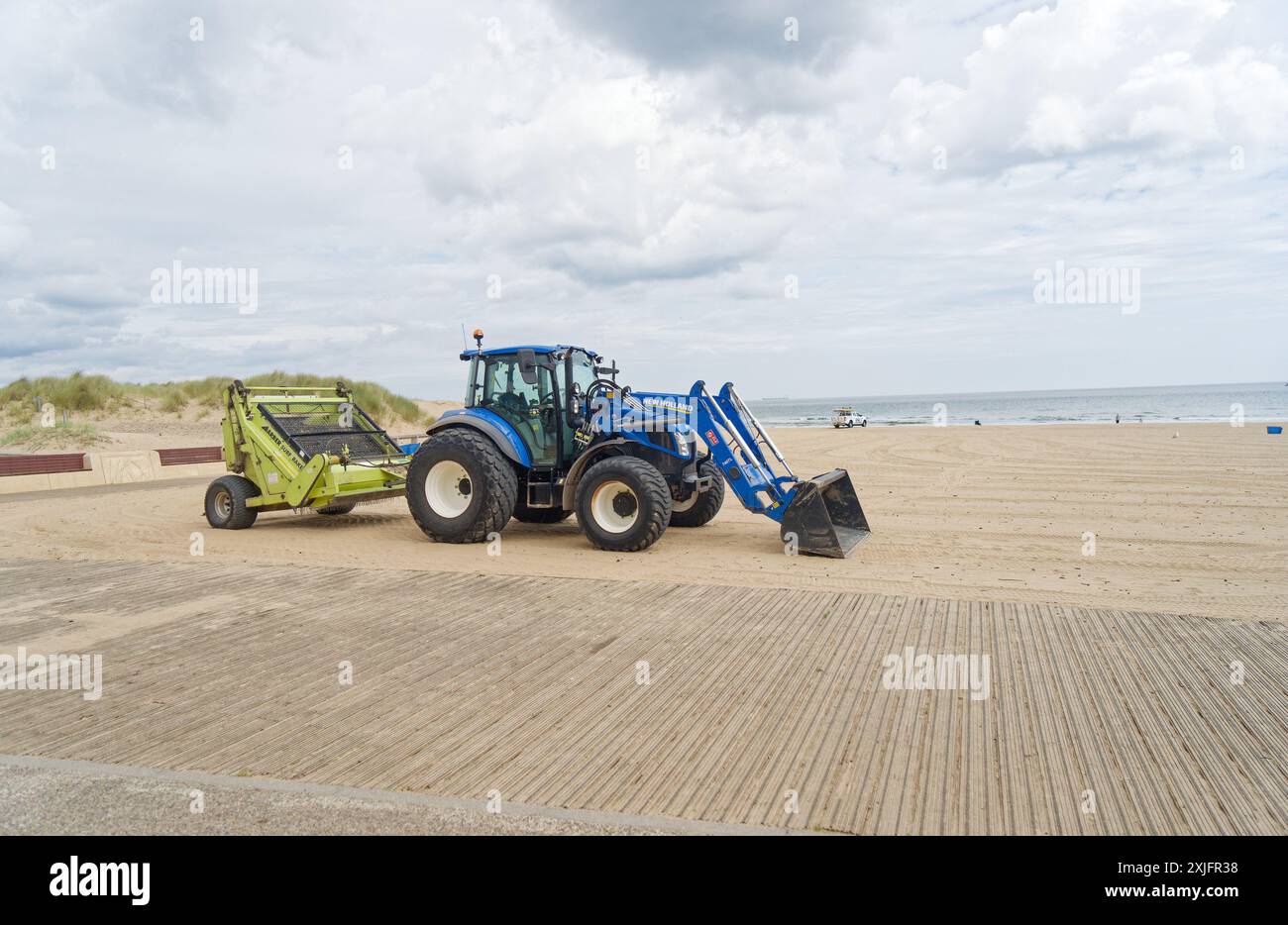 Tractor and Surf Rake at South Shields, UK. New Holland tractor and ...