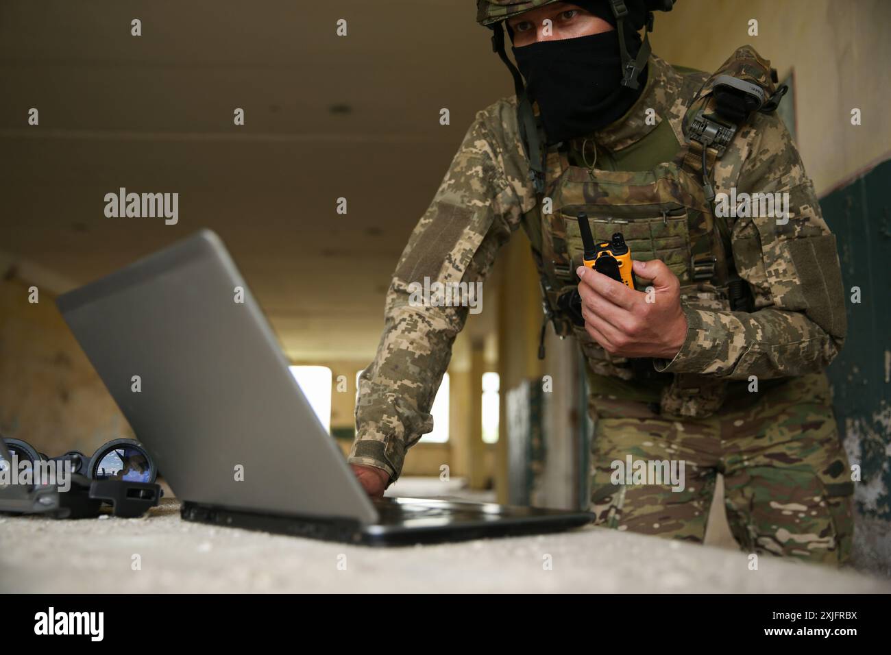Military mission. Soldier in uniform with radio transmitter using ...