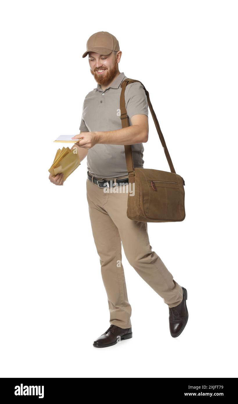 Happy young postman with brown bag delivering letters on white ...