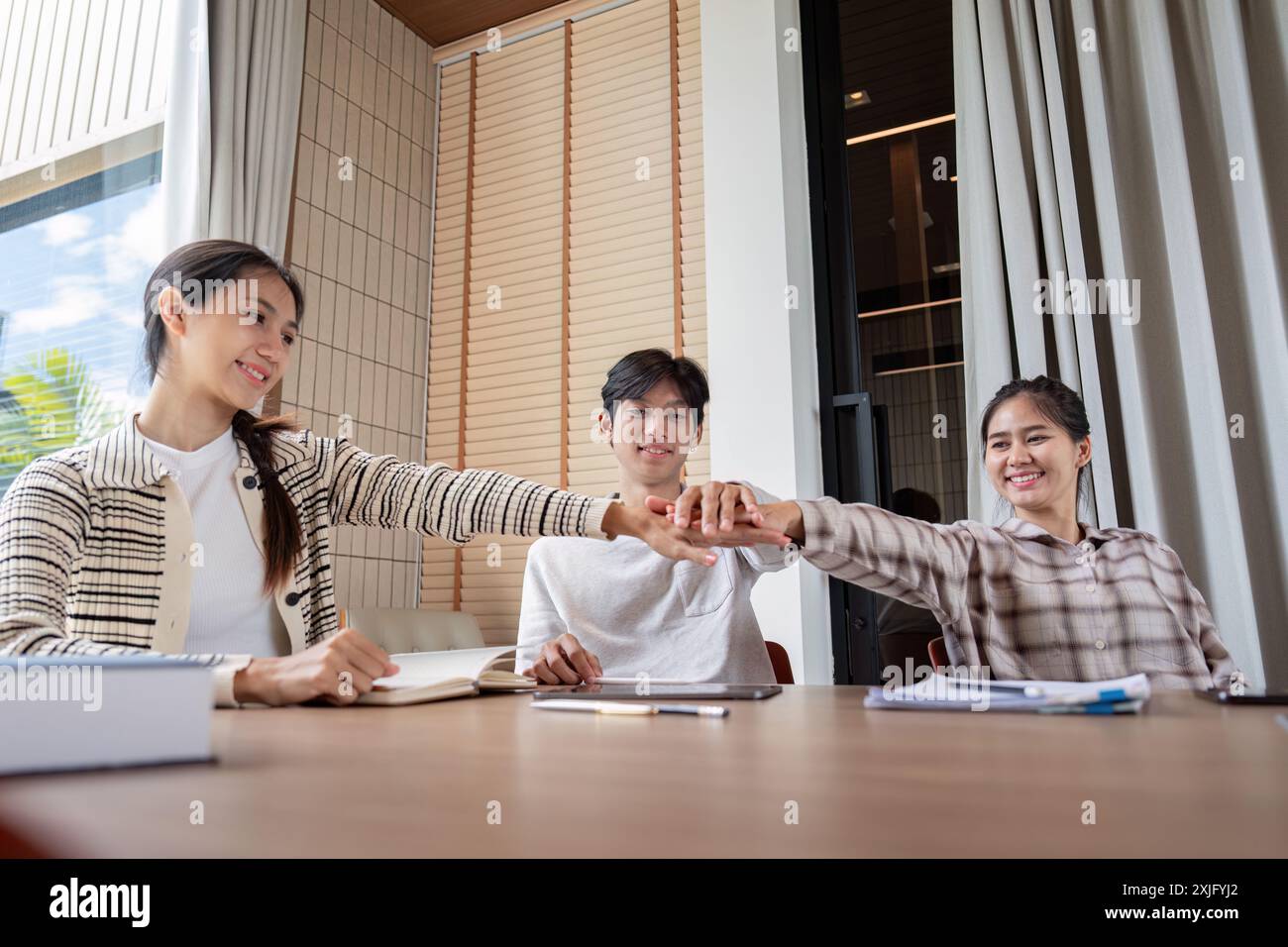 Group of Diverse Students Collaboration in Modern Study Room, Engaging in Teamwork and Academic ...