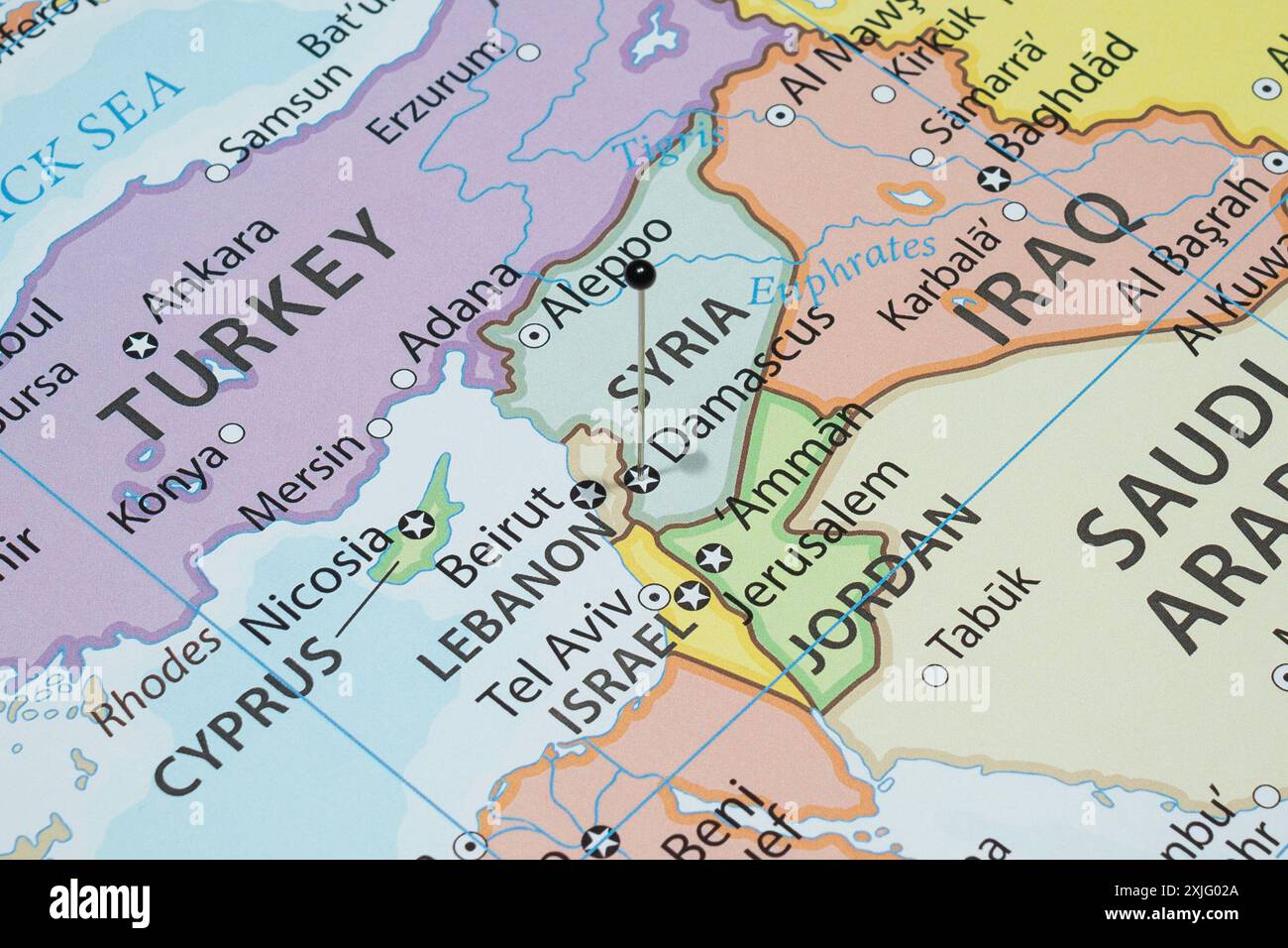 Close up to a Damascus city with a black pin needle into Syria country ...