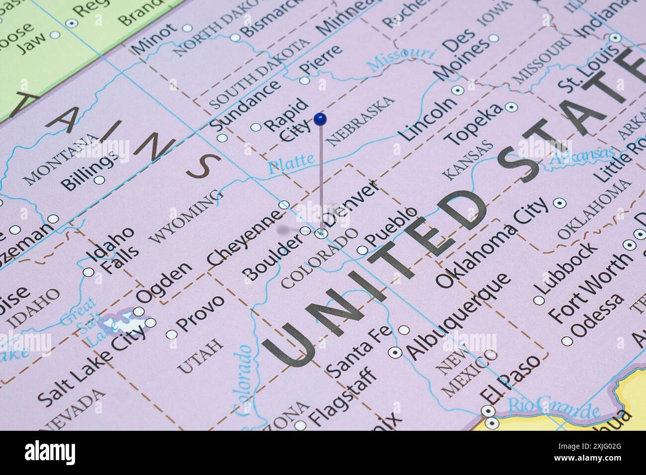 Close up to a Denver city with a blue pin needle into United States of ...