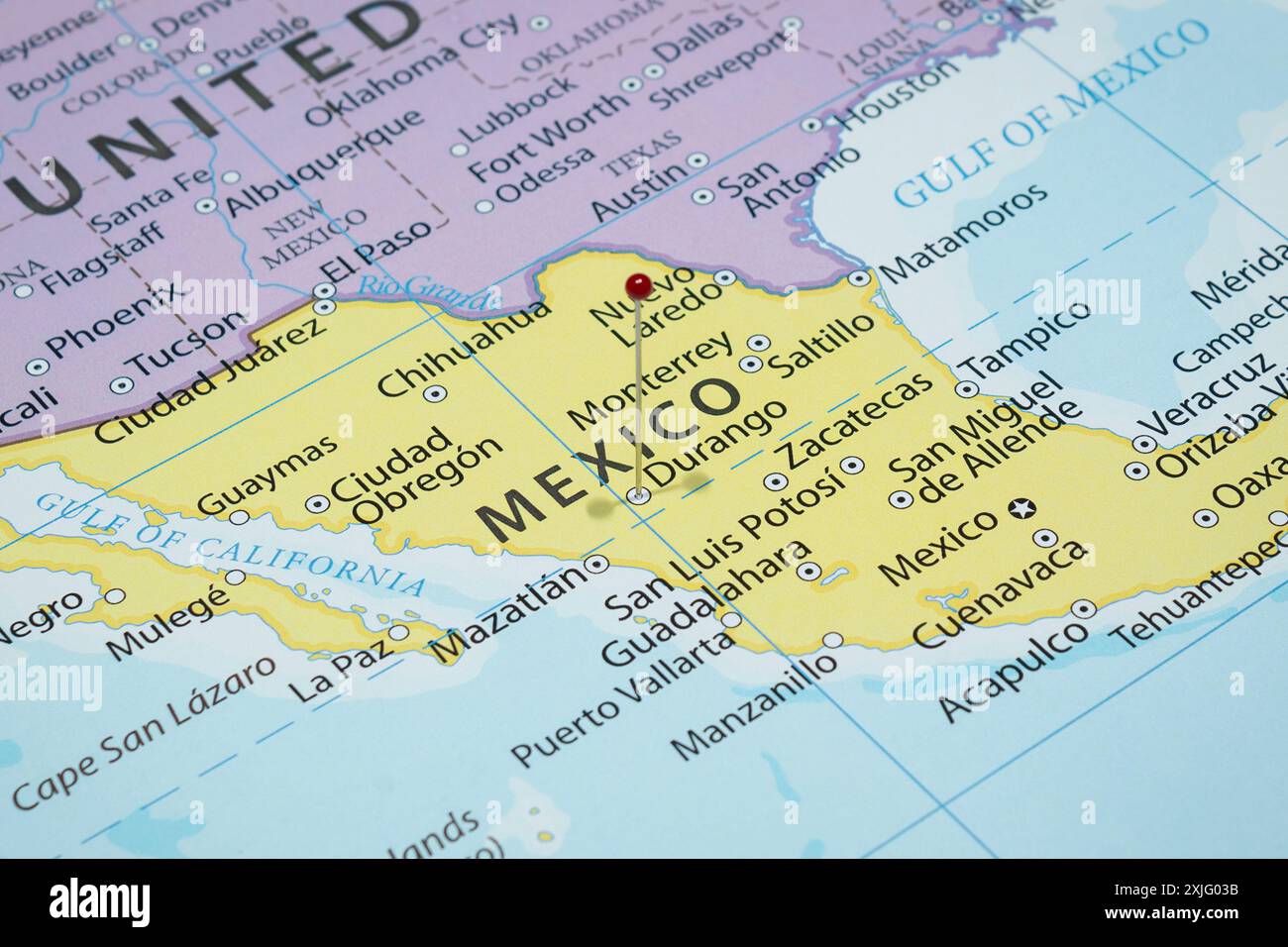 Close up to a Durango city with a red pin needle into Mexico country ...