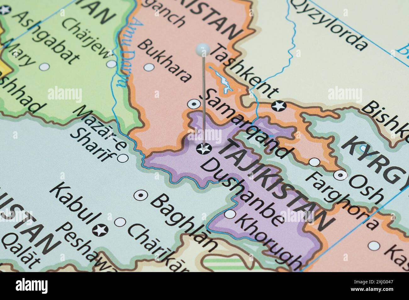 Close up to a Dushanbe city with a white pin needle into Tajikistan ...