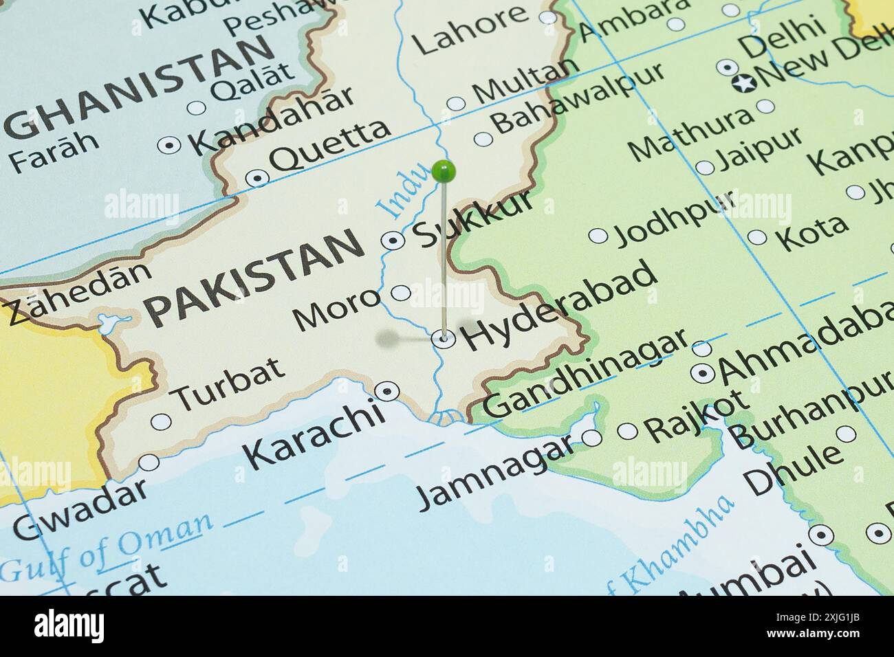 Close up to a Hyderabad city with a green pin needle into Pakistan ...