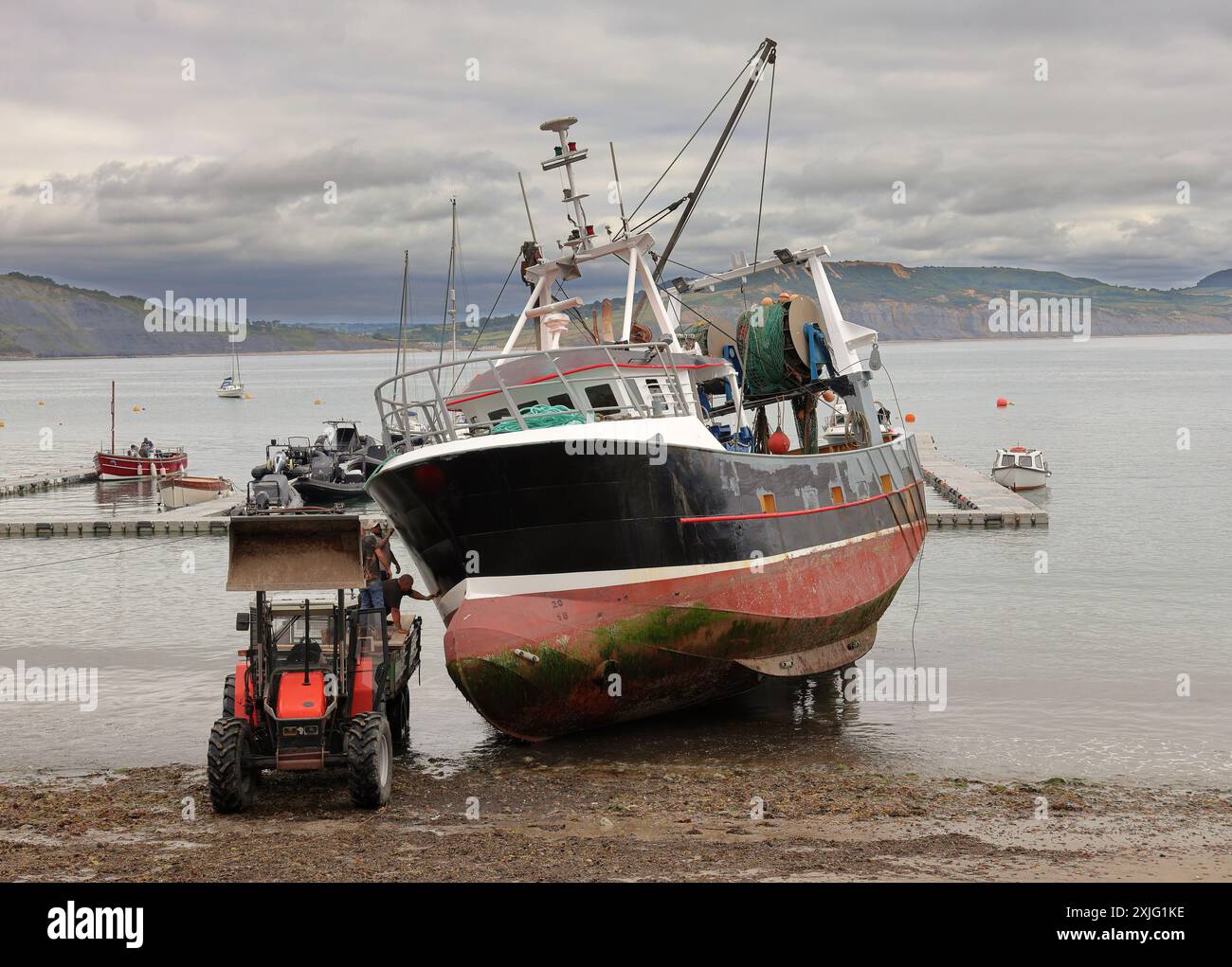 A beached Trawler fishing boat being maintained on English Coastal ...