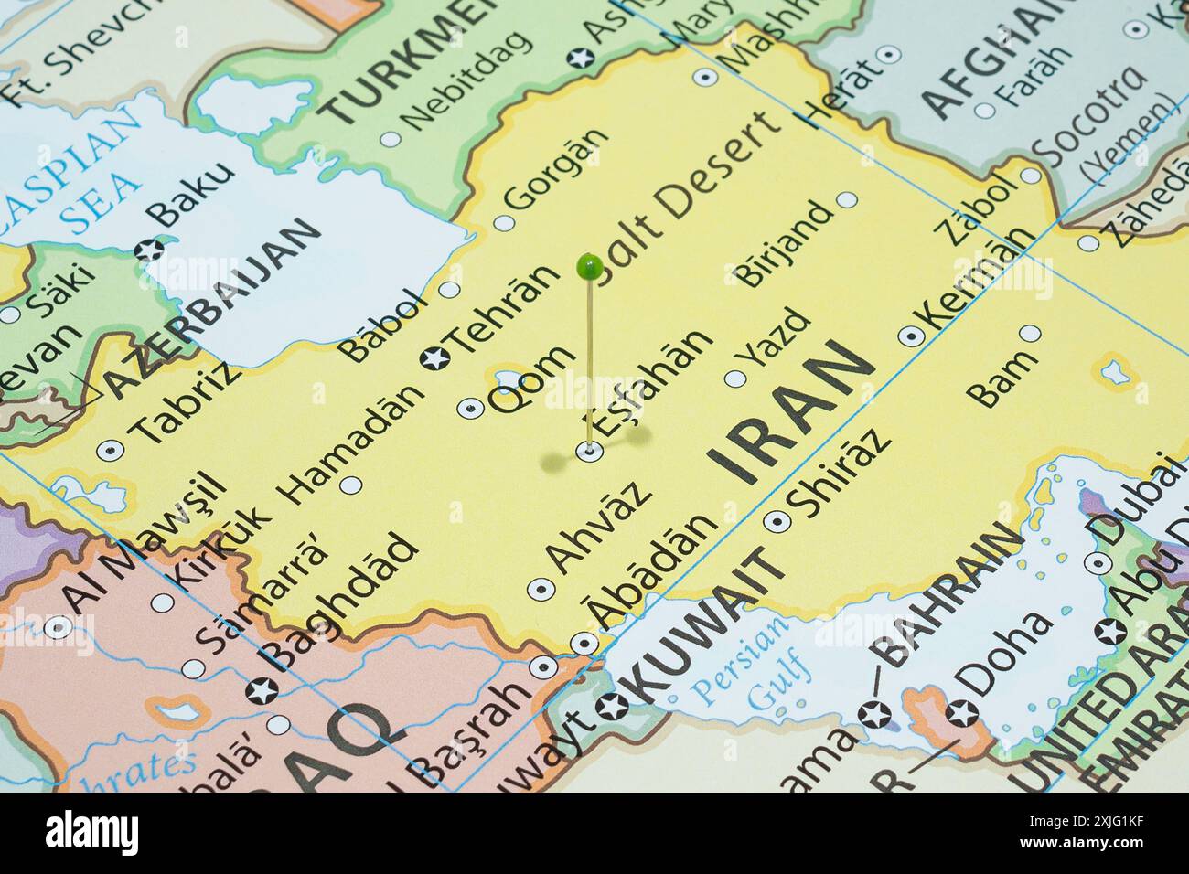 Close up to a Isfahan city with a green pin needle into Iran country ...