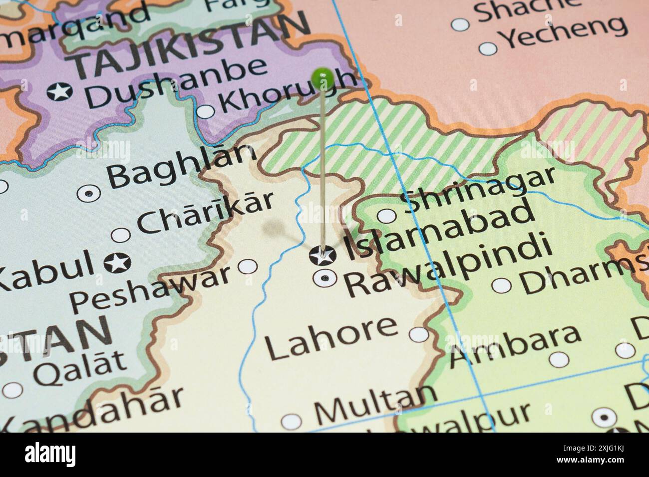 Close up to a Islamabad city with a green pin needle into Pakistan ...