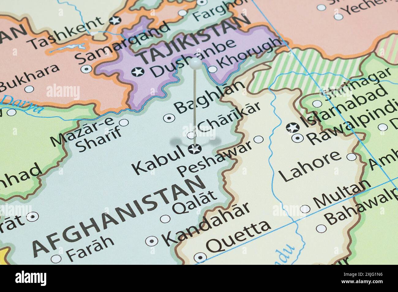 Close up to a Kabul city with a white pin needle into Afghanistan ...