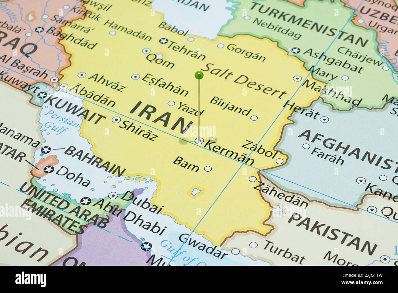 Close up to a Kerman city with a green pin needle into Iran country ...