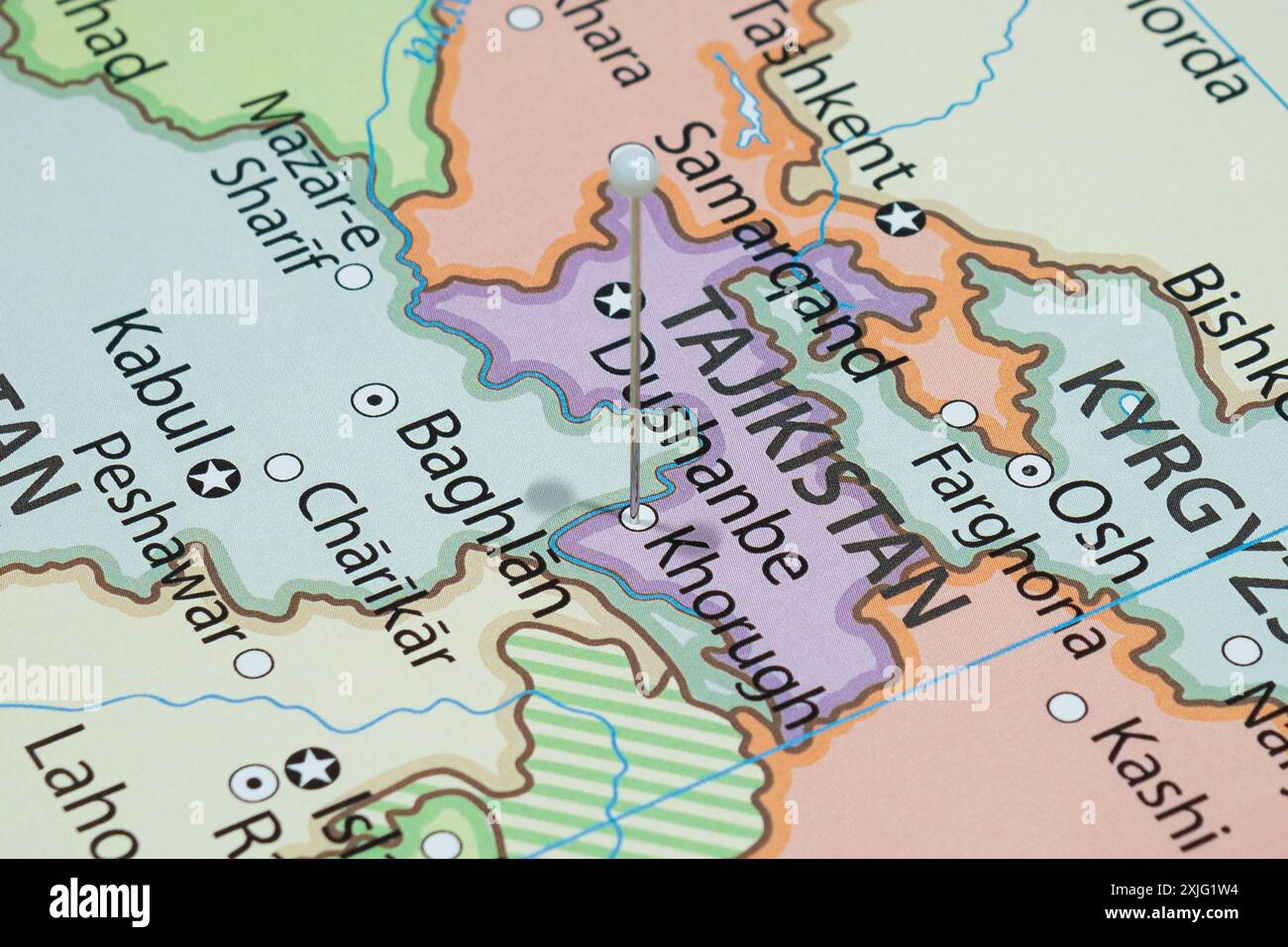 Close up to a Khorugh city with a white pin needle into Tajikistan ...