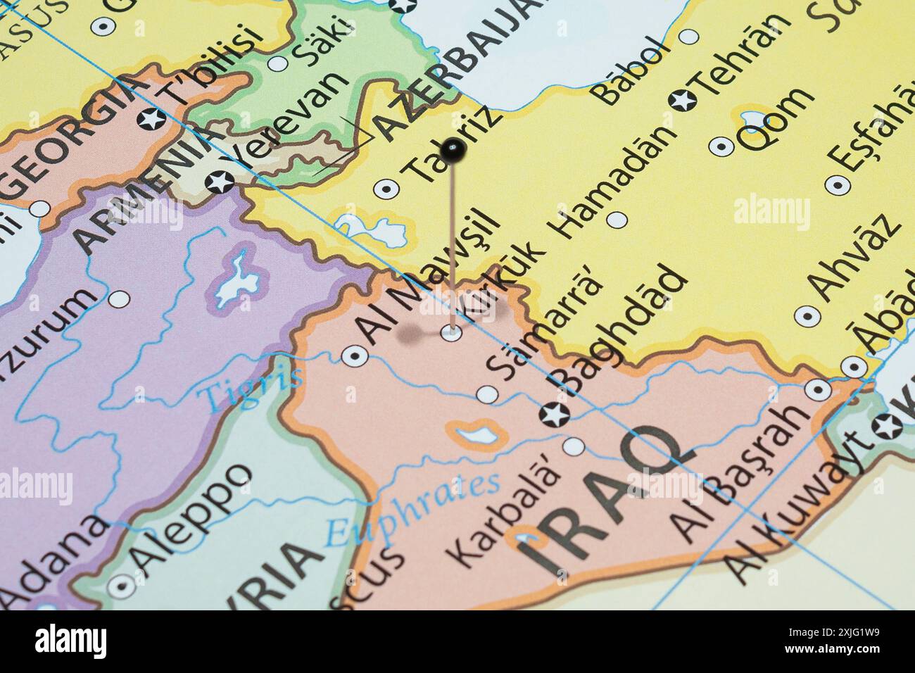 Close up to a Kirkuk city with a black pin needle into Iraq country ...