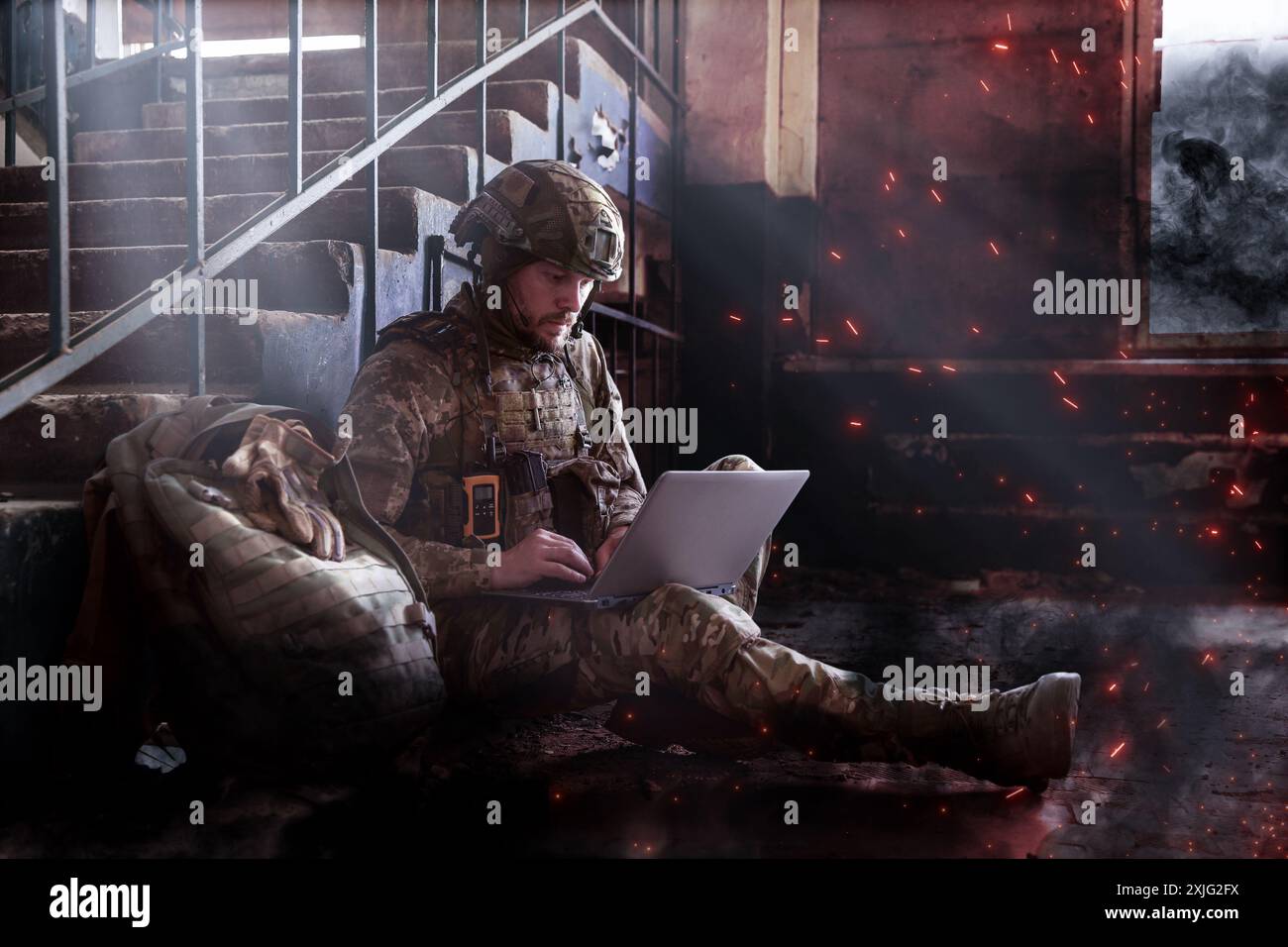 Soldier using laptop inside building during military operation Stock ...