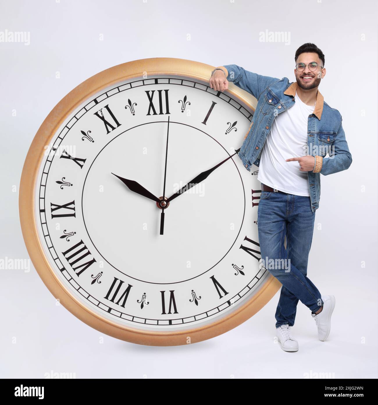 Man pointing big clock hi-res stock photography and images - Alamy