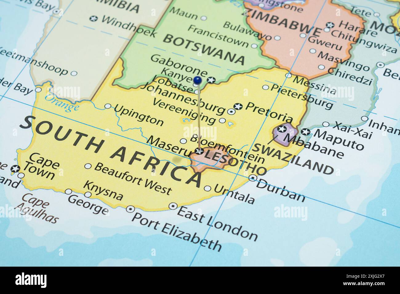 Close up to a Maseru city with a blue pin needle into Lesotho country ...