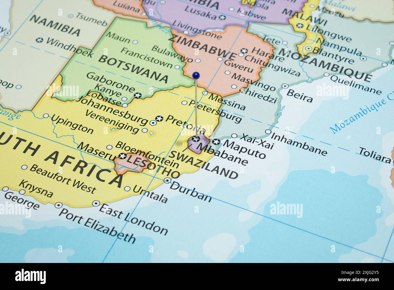 Close up to a Mbabane city with a blue pin needle into Eswatini country ...