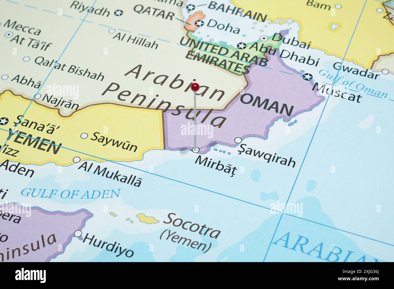 Close up to a Mirbat city with a red pin needle into Oman country ...